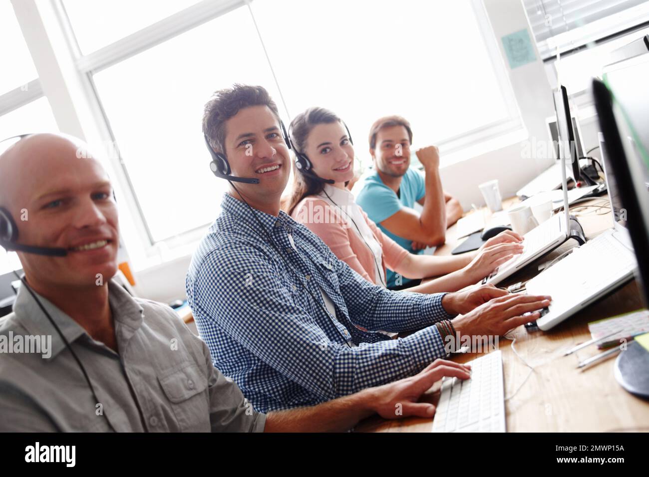 Smiling service providers. Portrait of sales assistants at the office ...