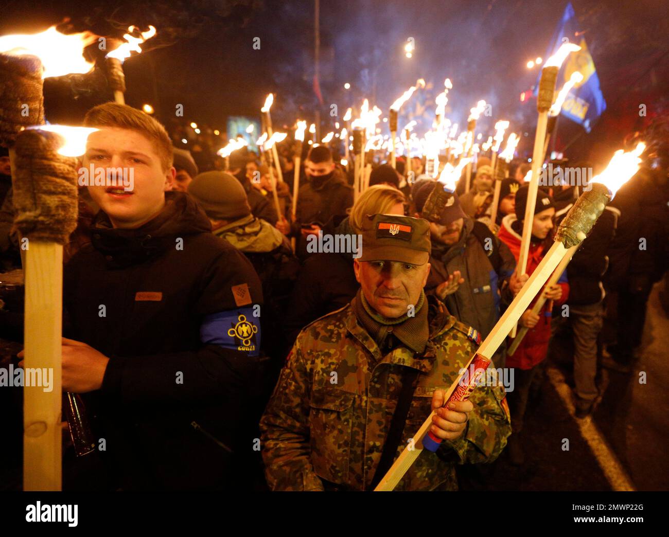 Members of the nationalist Svoboda (Freedom) party carry torches during ...