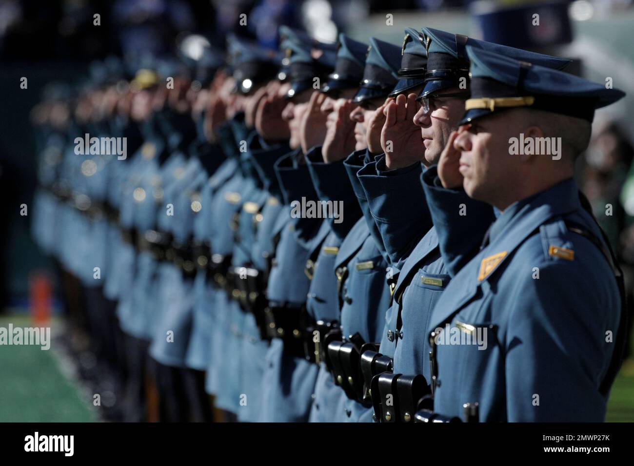 New Jersey State Police officers salute prior to an NFL football game ...