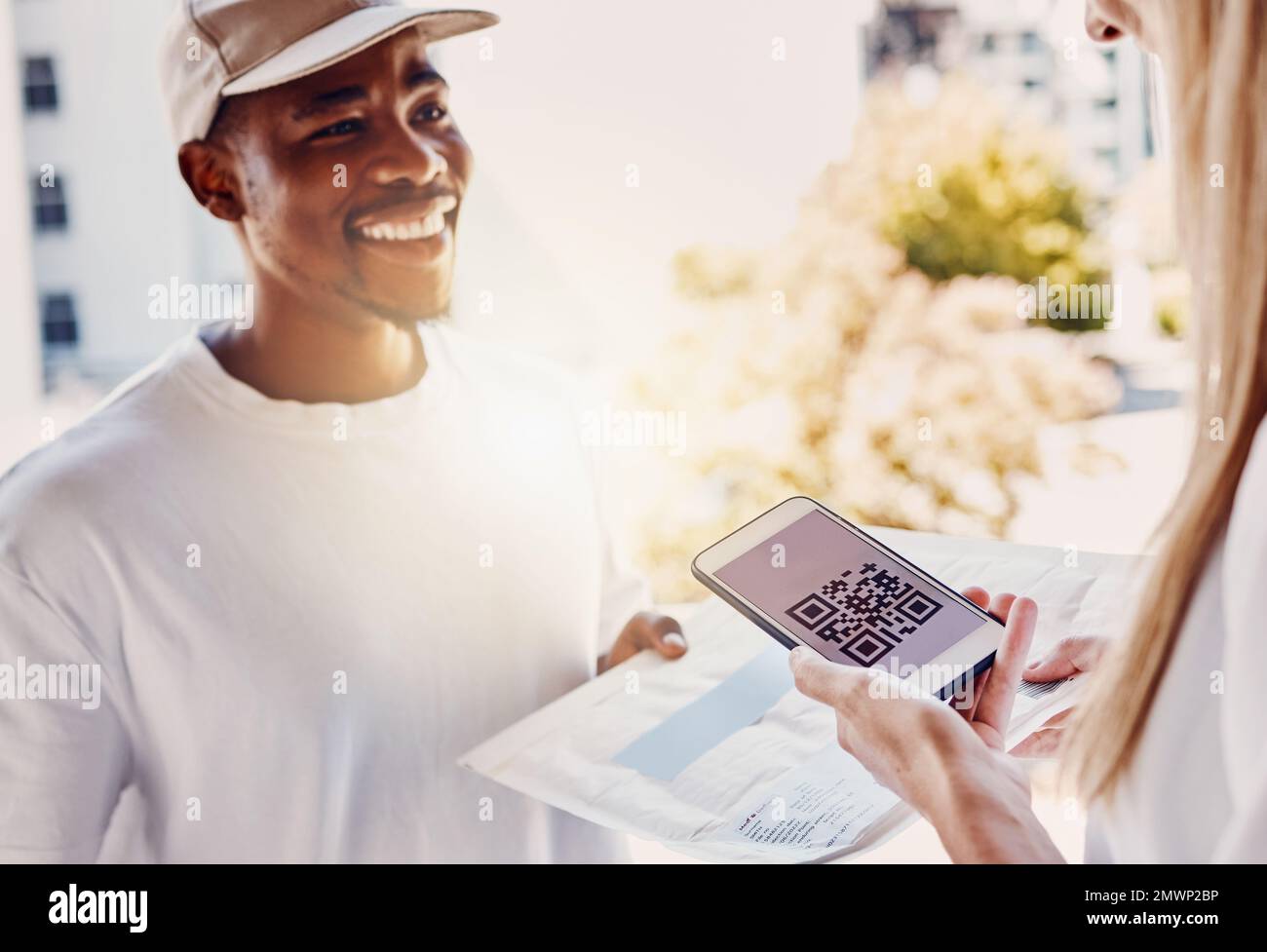 QR code, delivery man and customer phone in home for easy payment ...