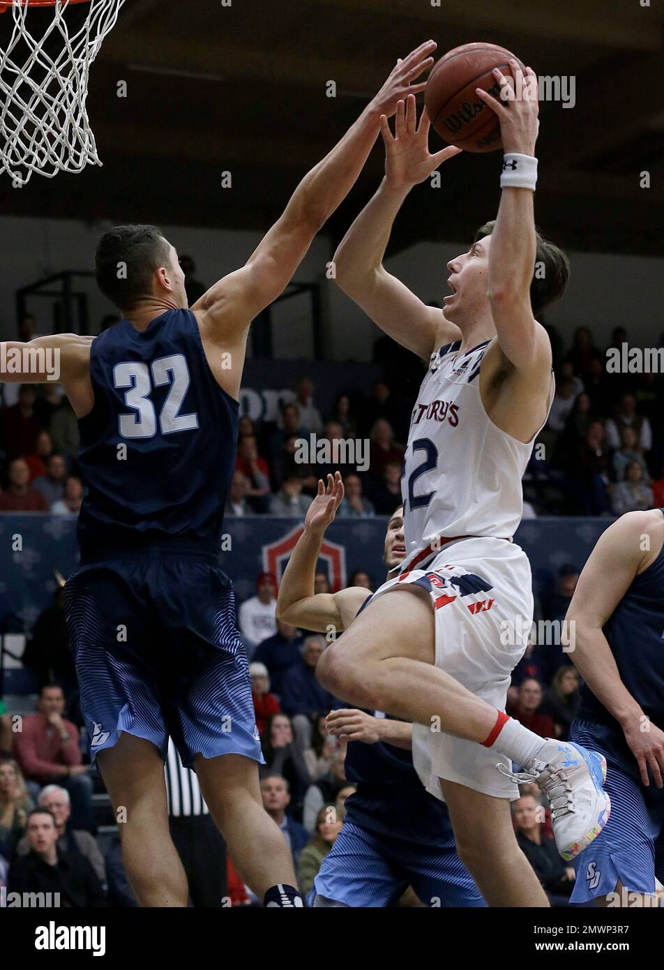Saint Mary's forward Dane Pineau, right, shoots against San Diego ...