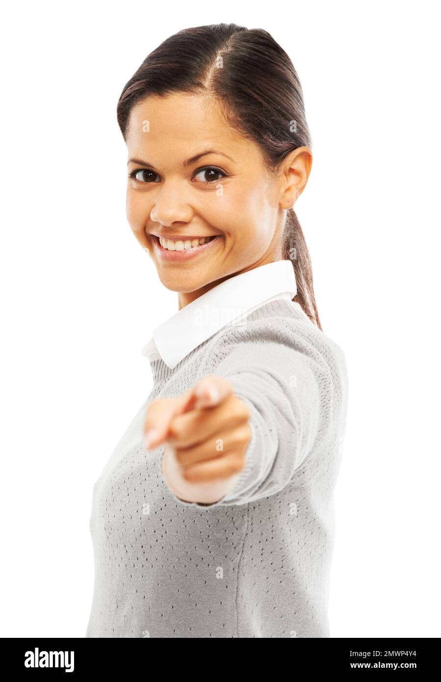 We want you. Studio portrait of an attractive young woman pointing to ...