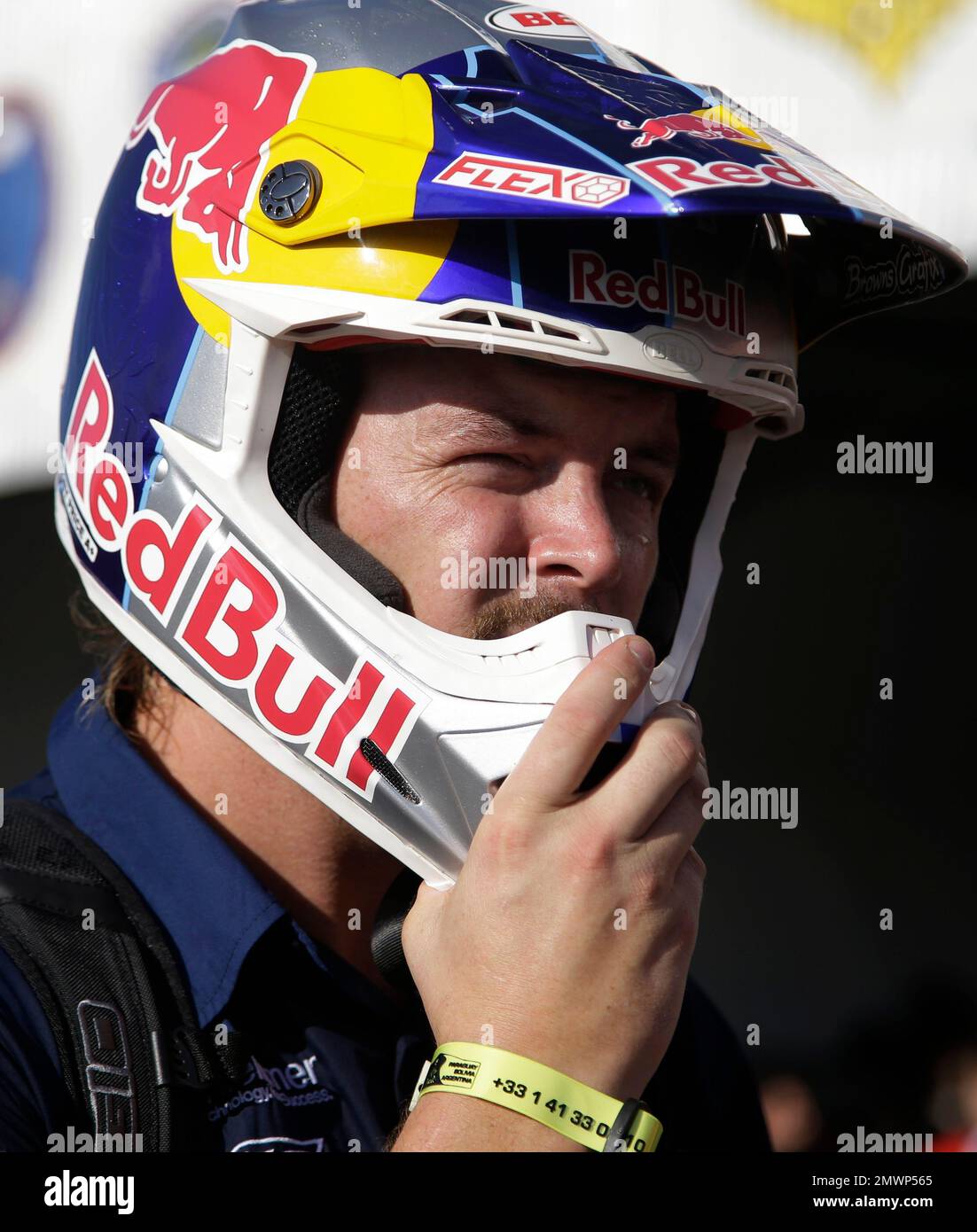 KTM motorbike rider Toby Price, of Australia, puts his helmet on after ...