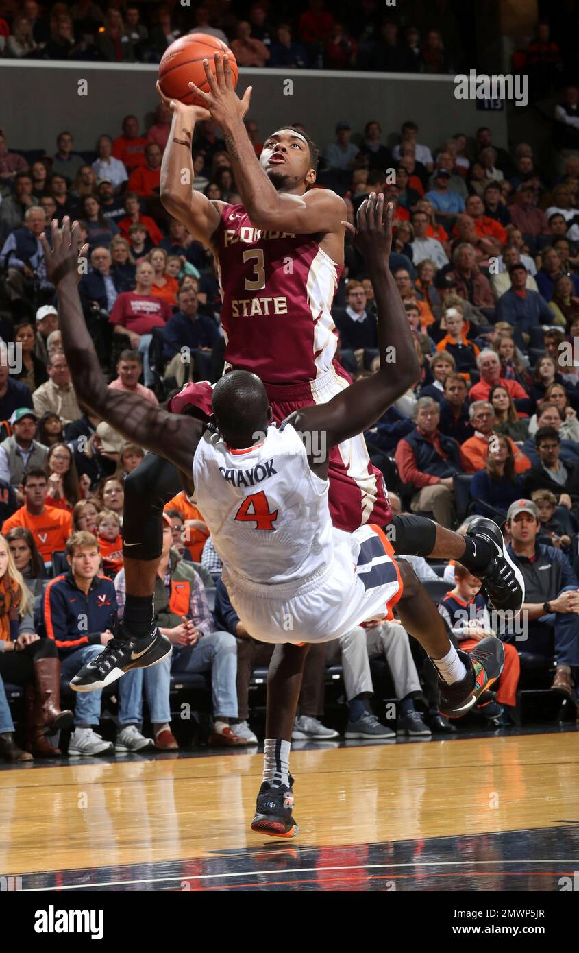 Florida State guard Trent Forrest (3) is fouled by Virginia guard ...
