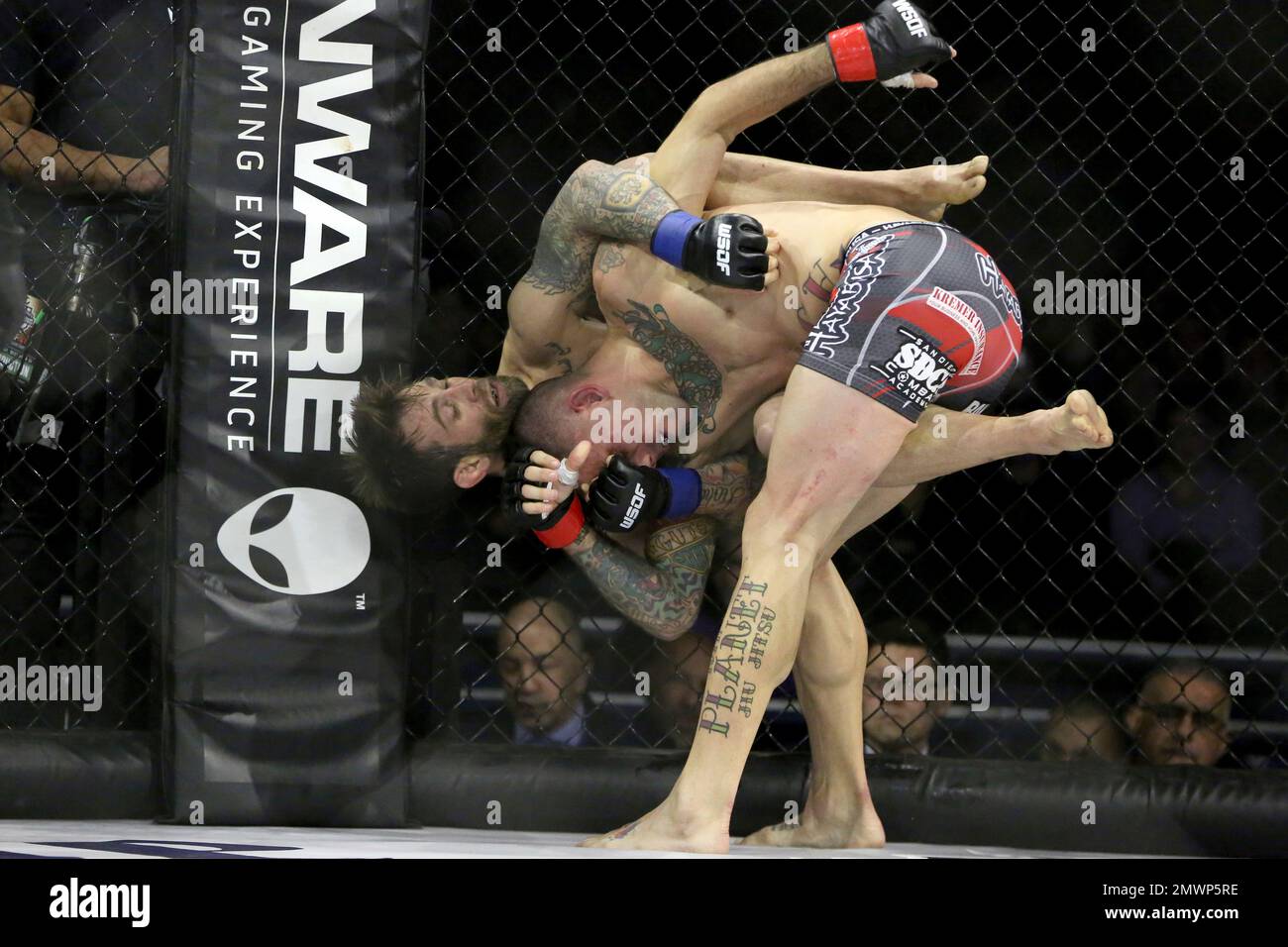 Shane Kruchten, top, is shaken off by Jeremy Mahon during their catchweight WSOF fight at the ...