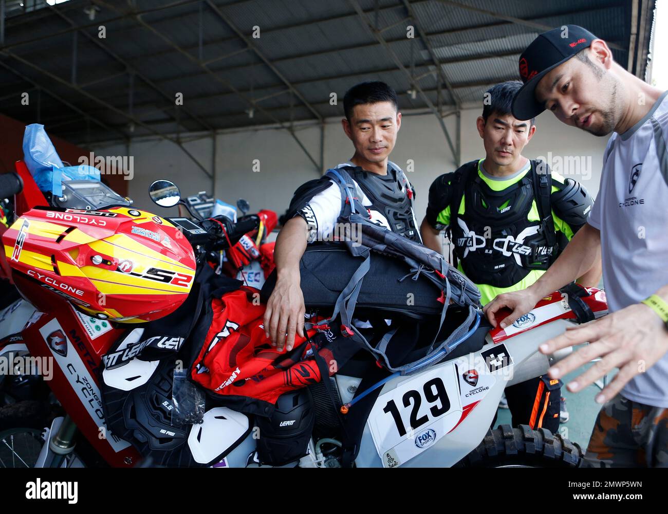 Dakar riders Zhang Min, right, Zhao Hongyi, left, and Jen Richie, of ...