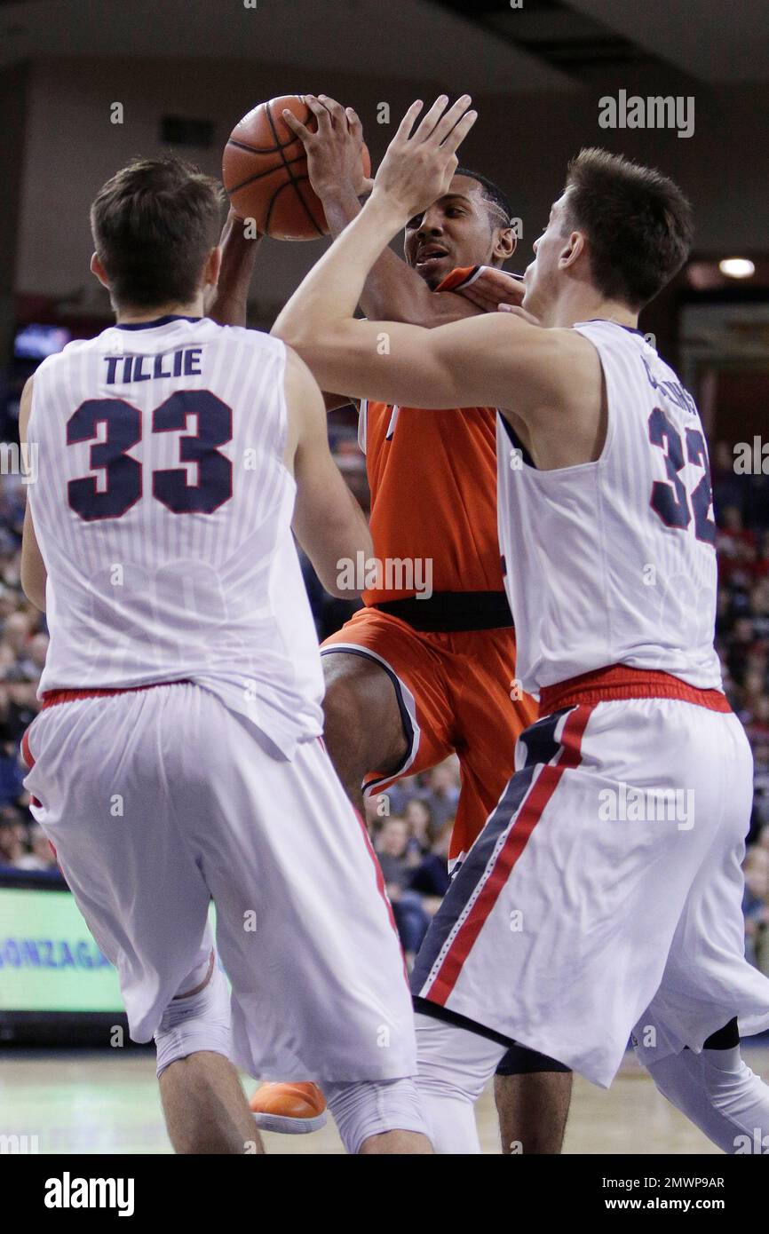 Pepperdine guard Lamond Murray Jr., center, drives while defended by ...