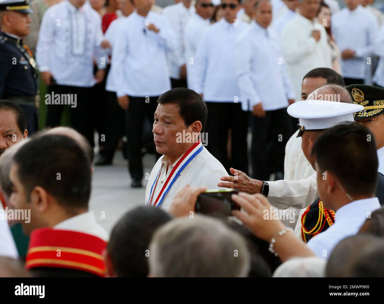 Philippine President Rodrigo Duterte walks to greet the crowd shortly ...