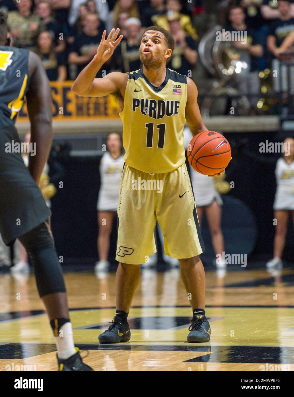 Purdue guard P.J. Thompson (11) organizes the offense in the second ...