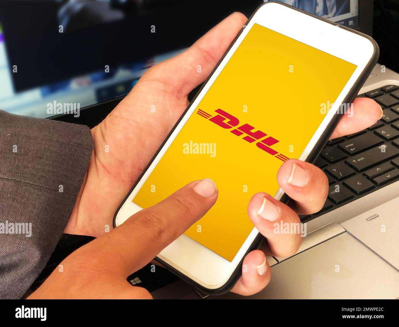 30.1, Pakistan. Man using DHL Mobile application for delivering and ...