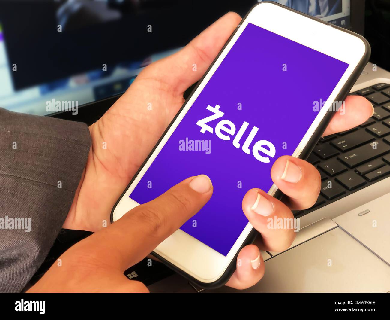 30.1. Pakistan. Online payment system zelle editorial background with man touching the screen ...