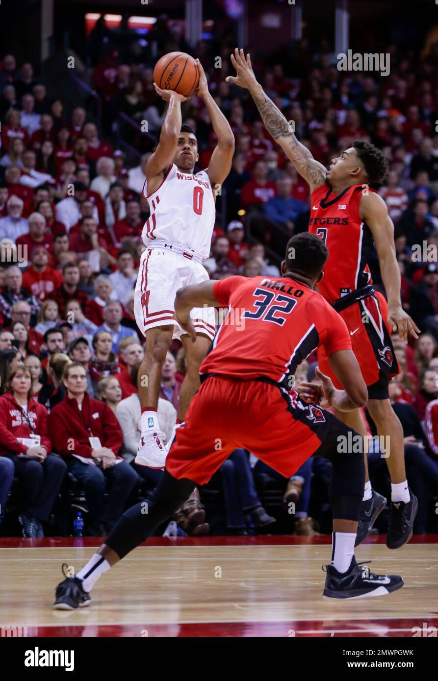 Wisconsin's D'Mitrik Trice (0) shoots against Rutgers' Ibrahima Diallo ...