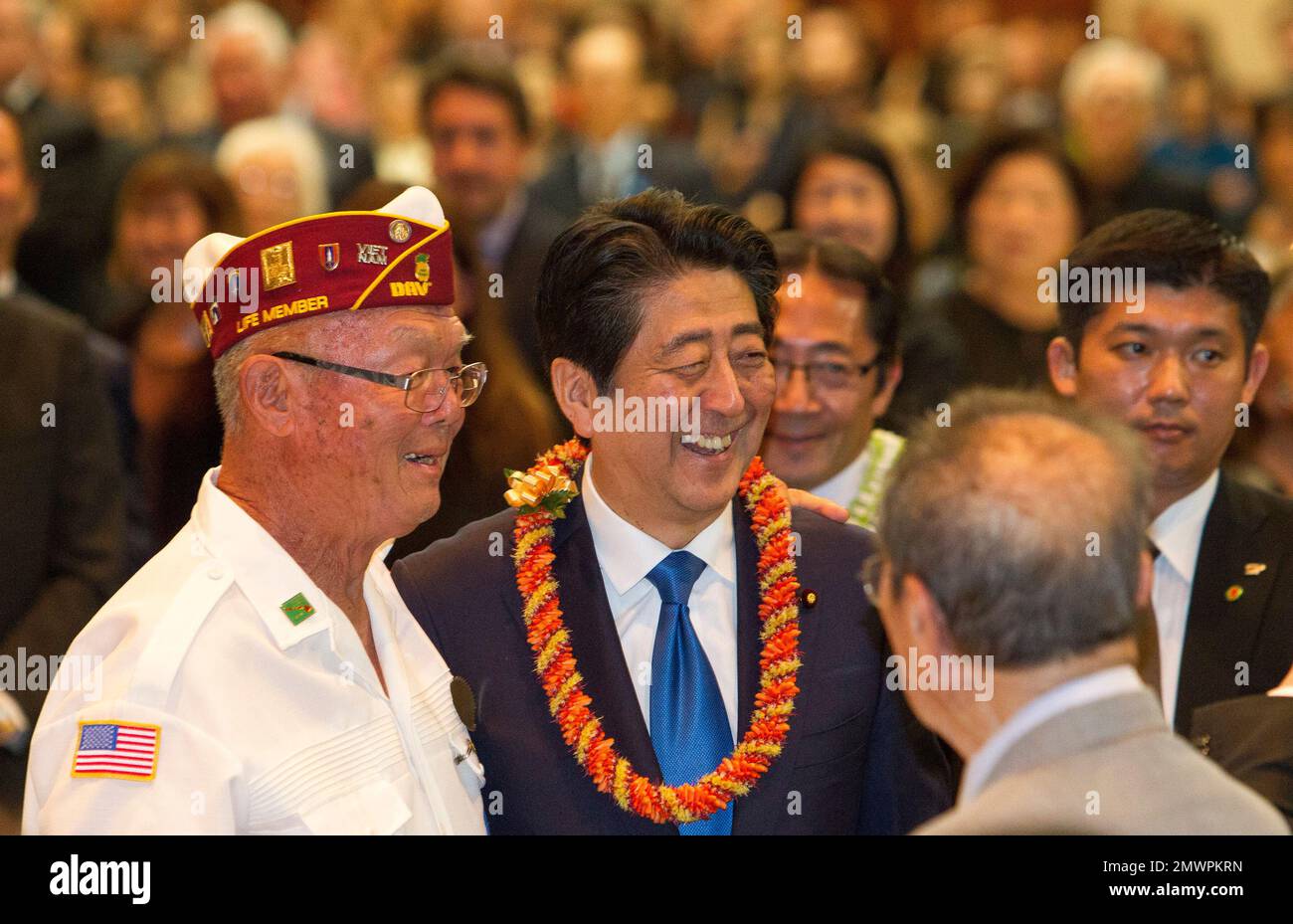 Japanese Prime Minister Shinzo Abe, center, greets guests at a dinner ...