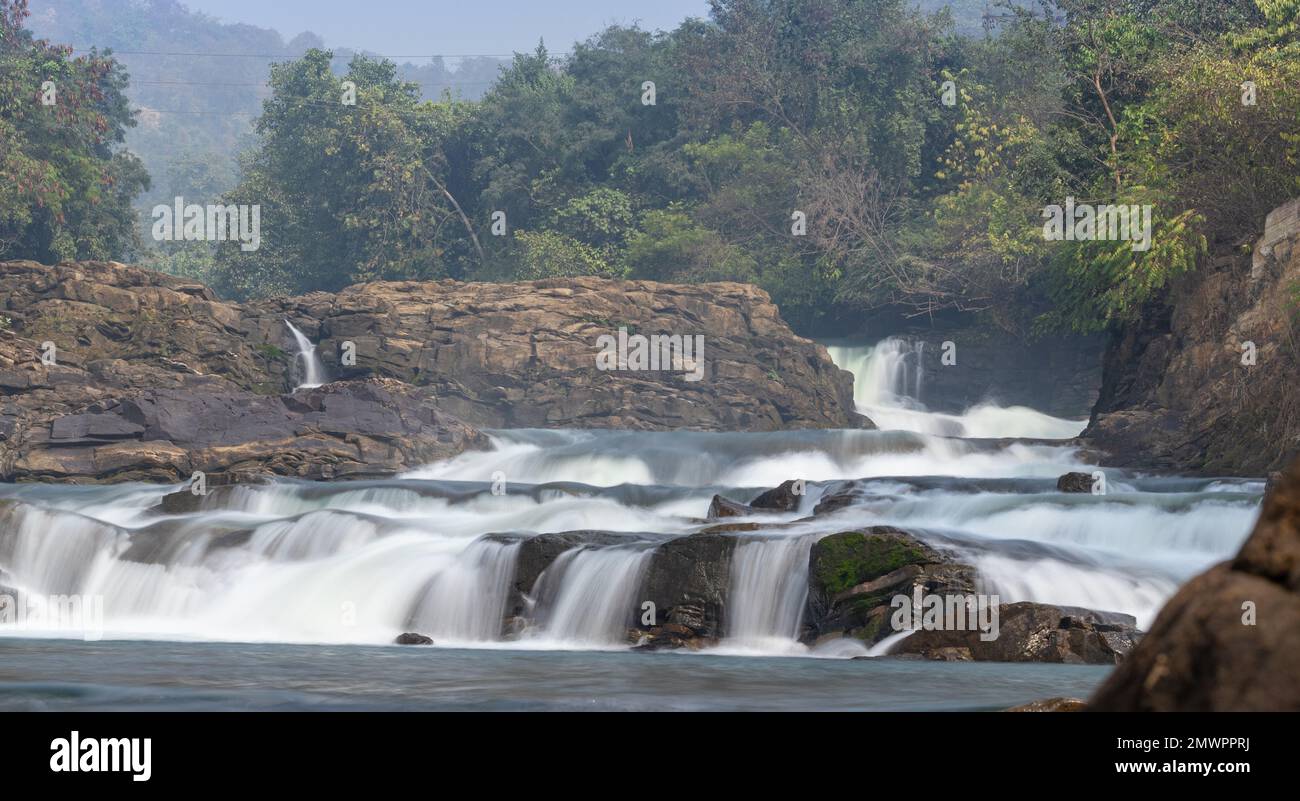Long exposure photo of smooth waterfall flowing through steps Stock ...