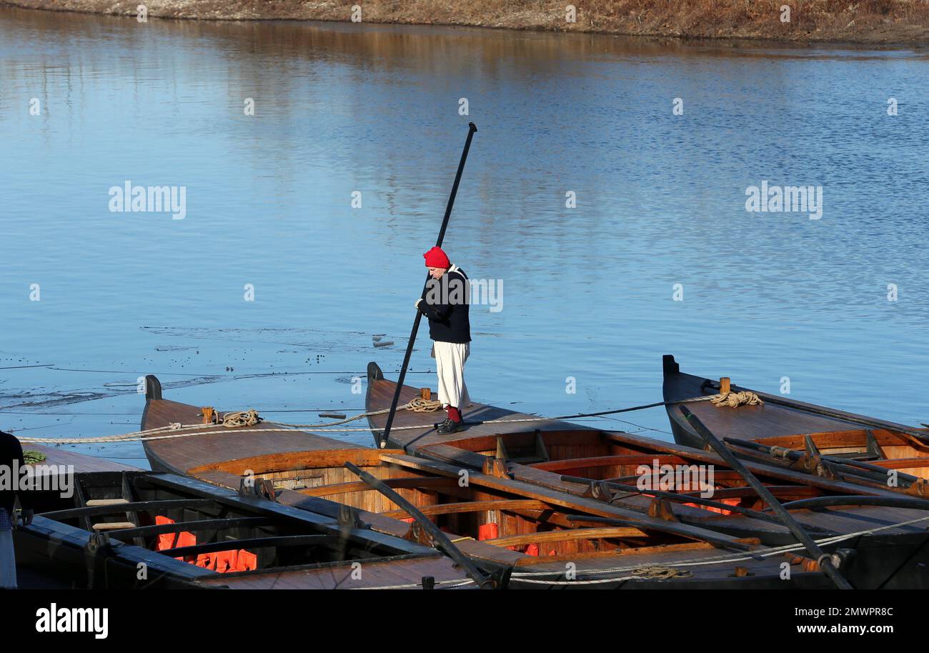 A man prepares boats for a re-enactment of Gen. George Washington's ...