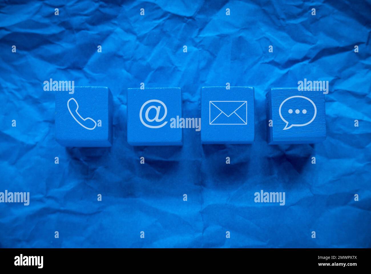 Icon of communication type on blue wooden cube. Contact us or Customer ...