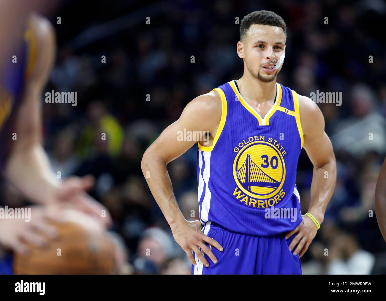 Golden State Warriors guard Stephen Curry watches as a teammate shoots ...