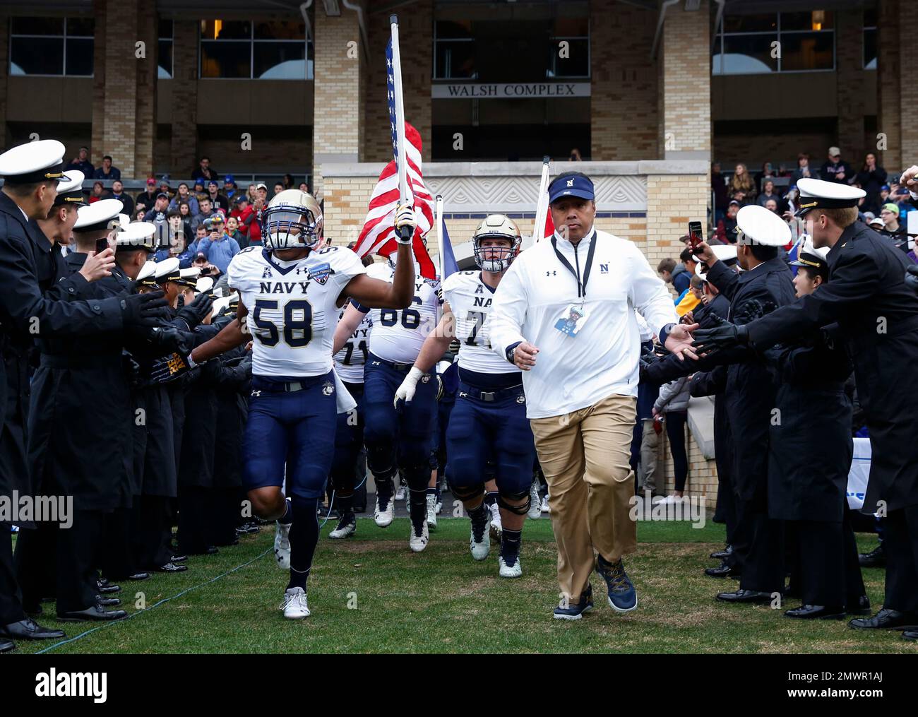 Navy head coach Ken Niumatalolo and linebacker Josiah Powell (58) lead ...