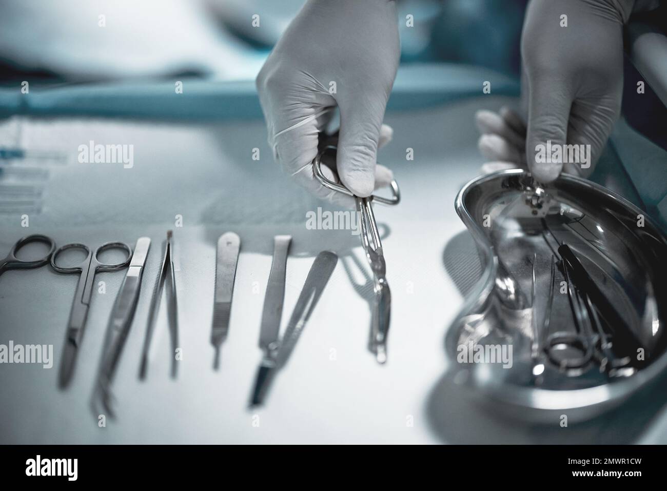 Operation, doctor and medical instruments for surgery in a ER or ...