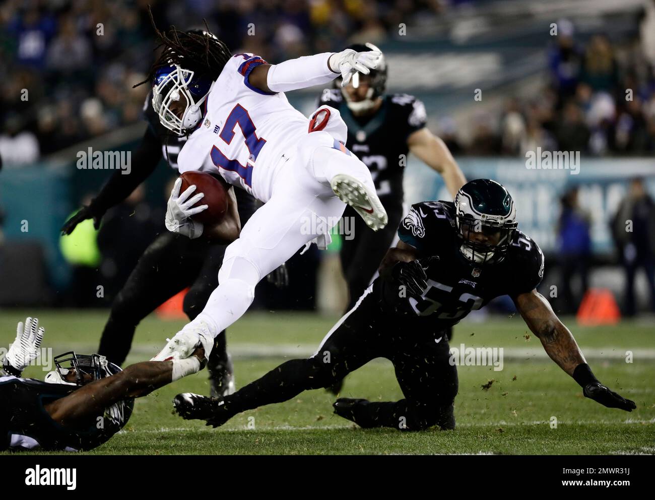 New York Giants' Dwayne Harris (17) is sent flying by a hit from ...
