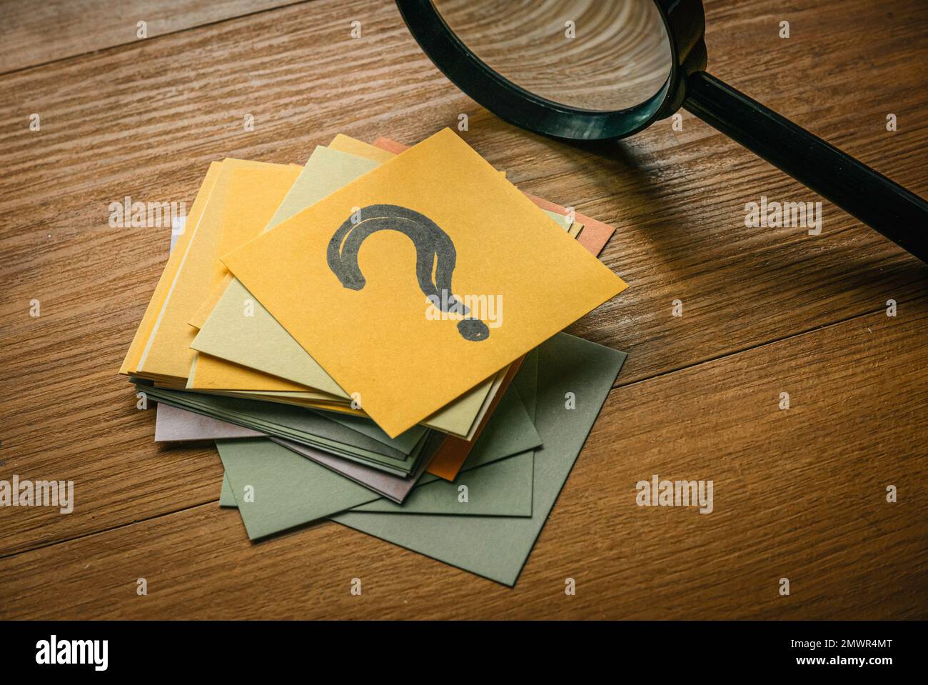 Questions and answers concept. A stack of paper with a paper on top ...