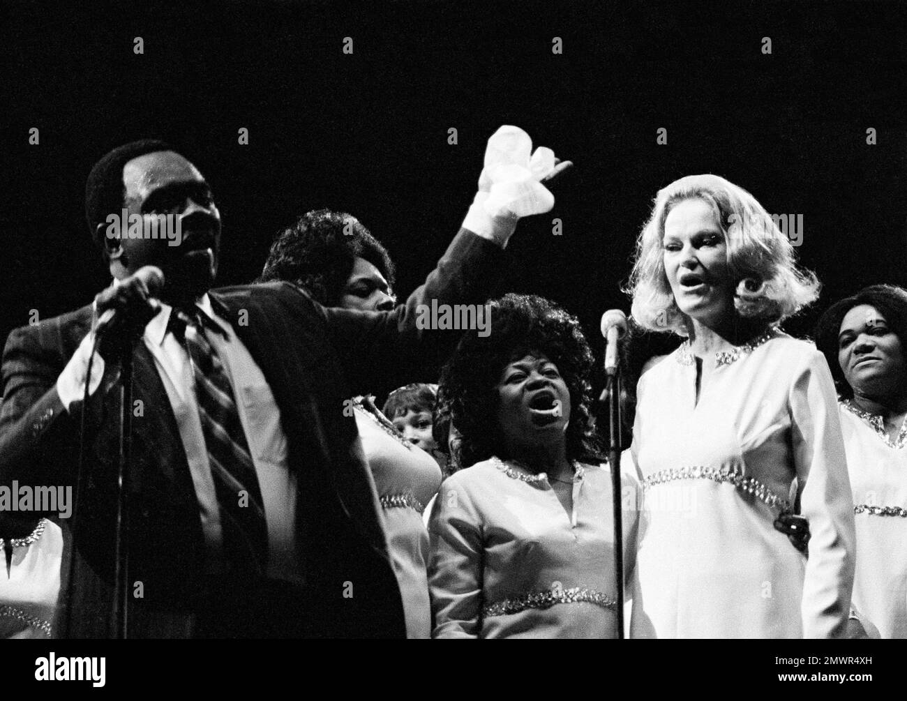 Tobacco heiress, Doris Duke, right, sings with Rev. Lawrence Roberts ...