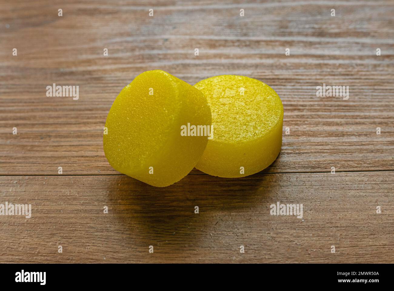 Block of toilet deodorant. Yellow naphthalene balls. Mothball Stock ...