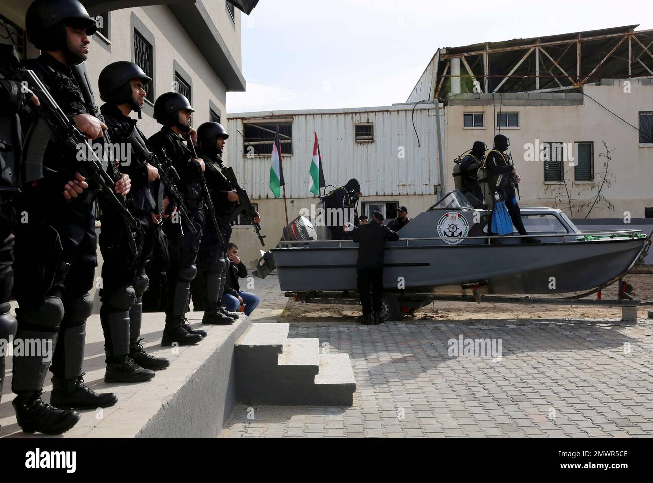 Palestinian Hamas naval security forces stand at attention during the ...
