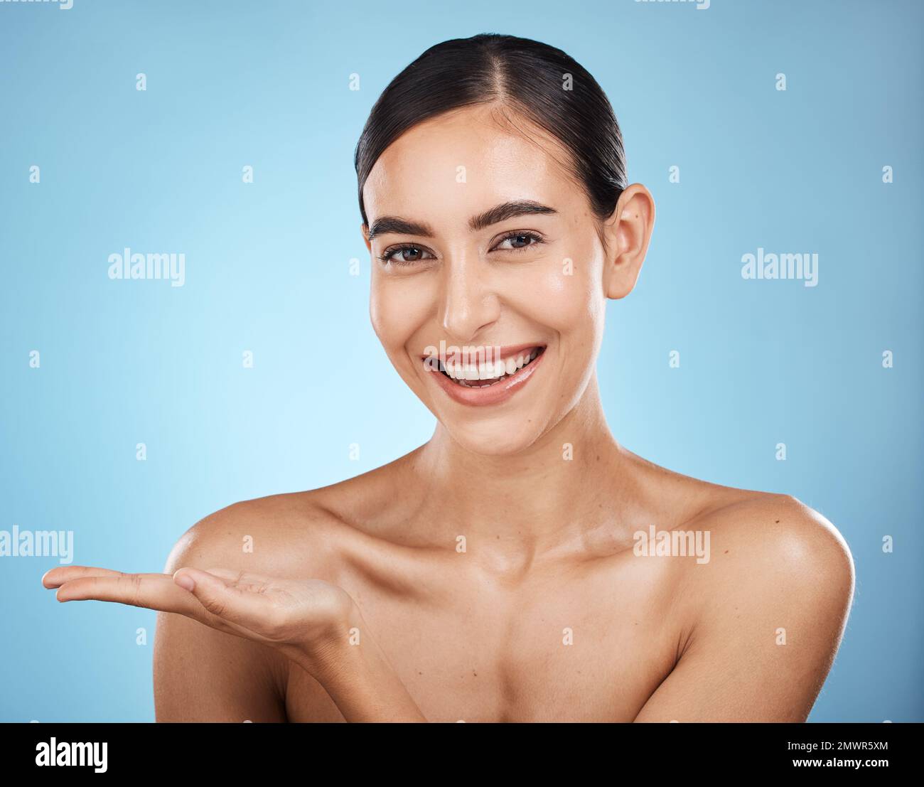 Portrait, beauty skincare and woman with product placement in studio ...