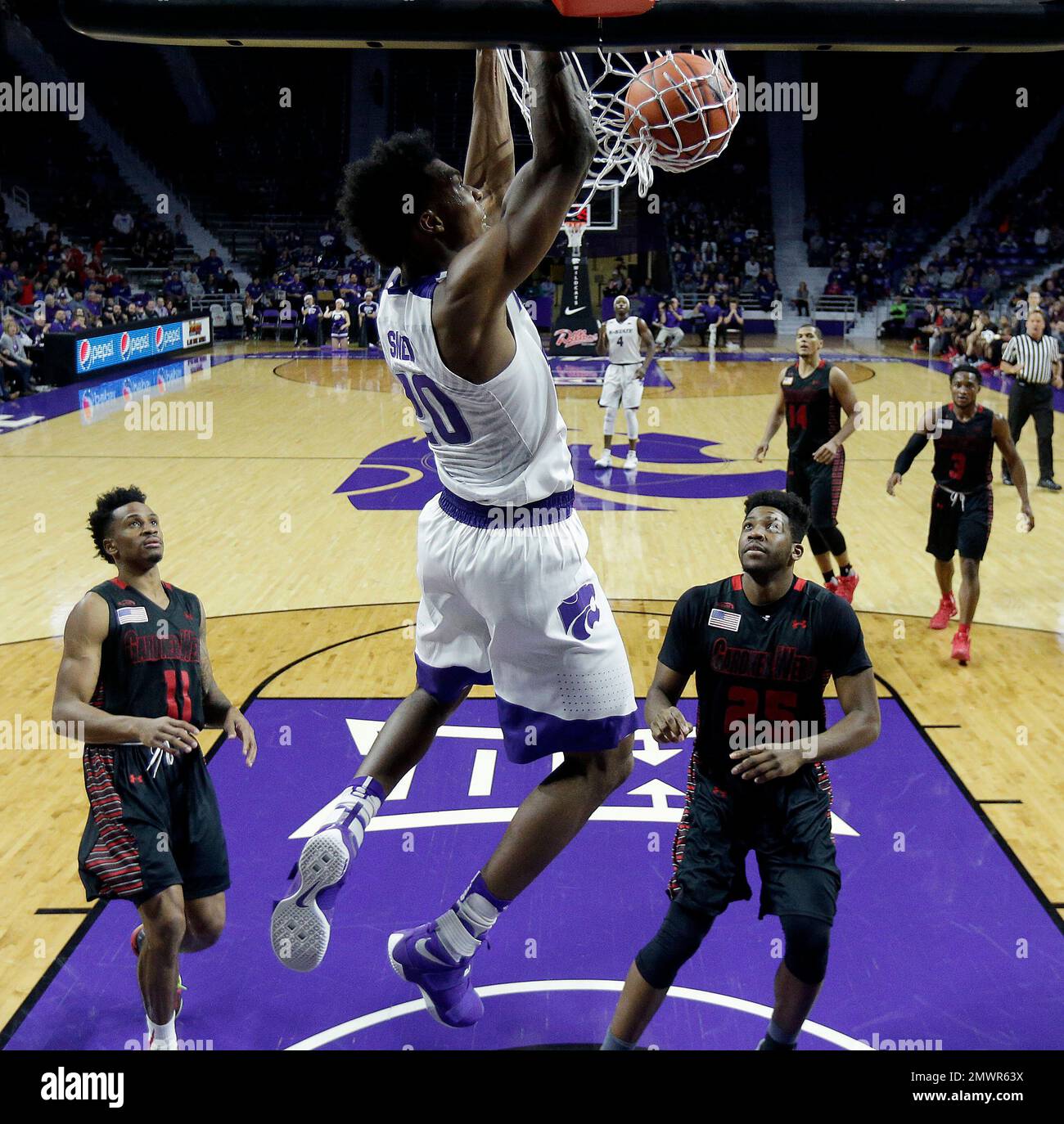 Kansas State's Xavier Sneed (20) dunks during the second half of an ...