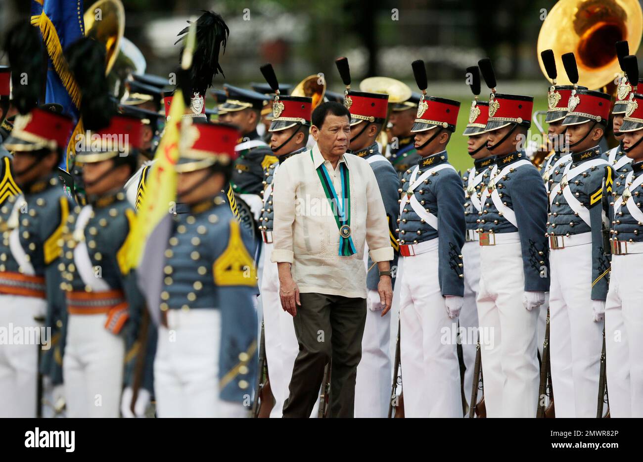 Philippine President Rodrigo Duterte inspects troops during the 81st ...