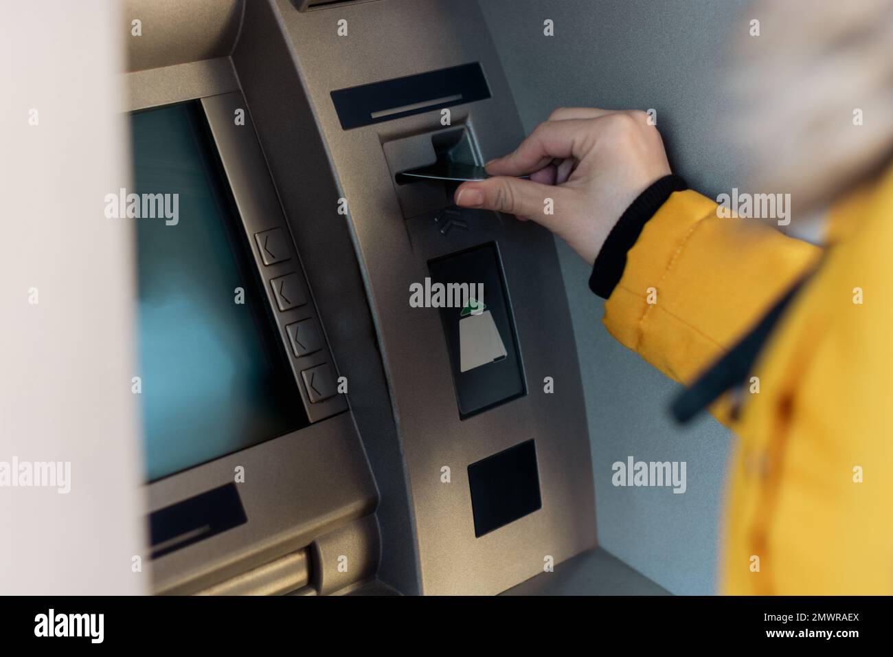 Hand inserting credit card hi-res stock photography and images - Alamy