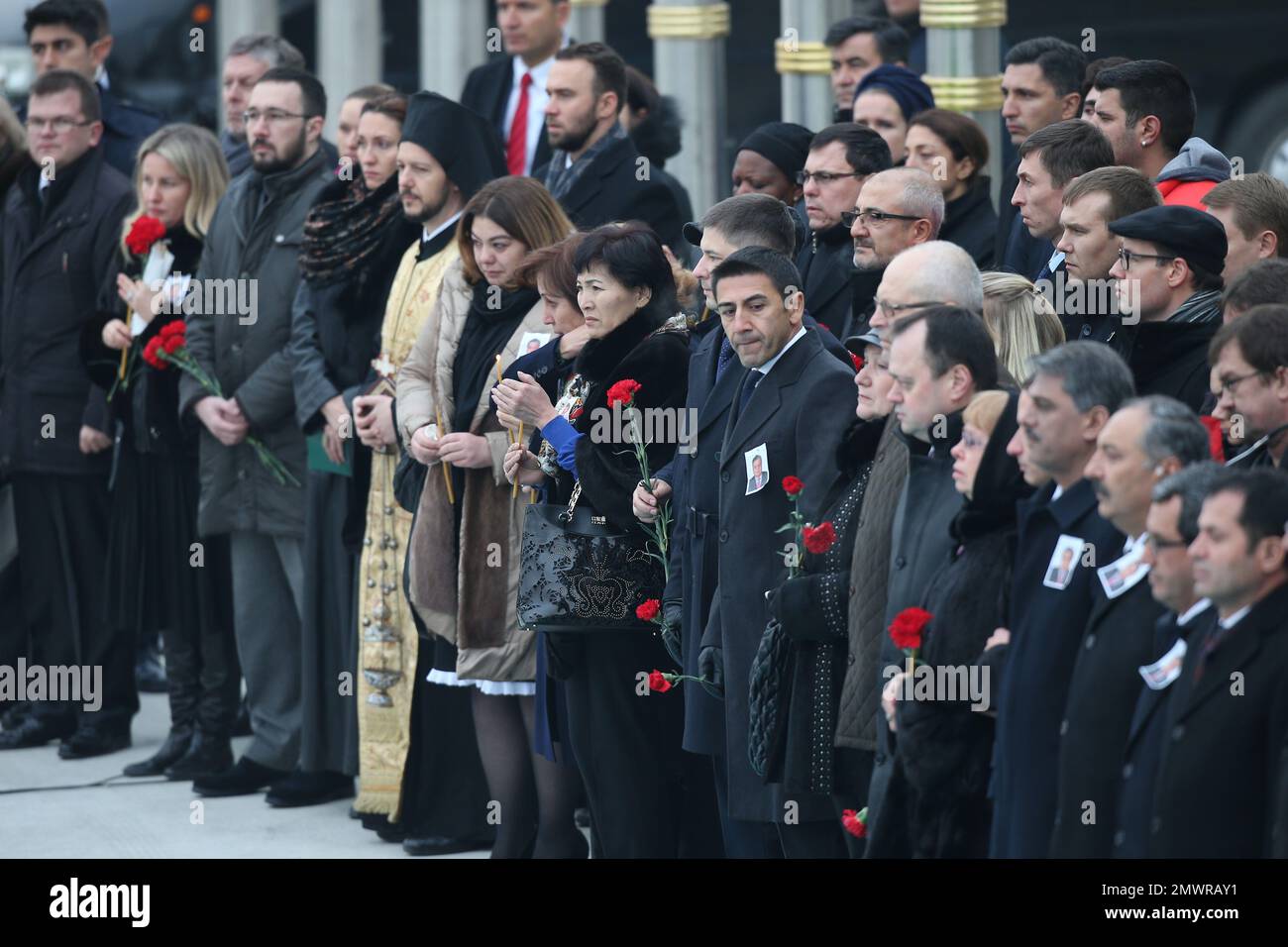 People attend a ceremony for the Russian Ambassador to Turkey, Andrei ...