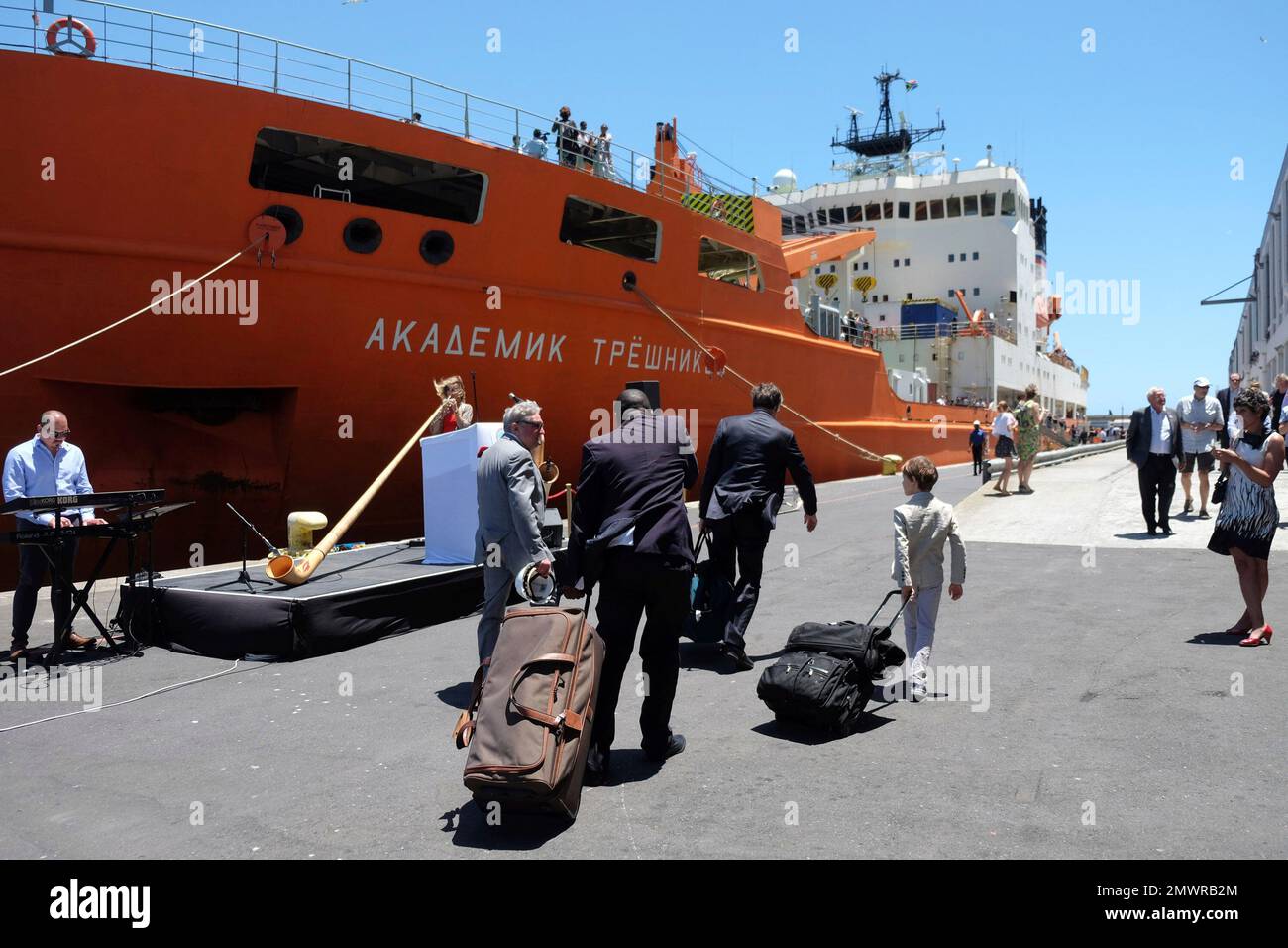 Team members arrive with luggage to board the Akademik Treshnikov, a ...