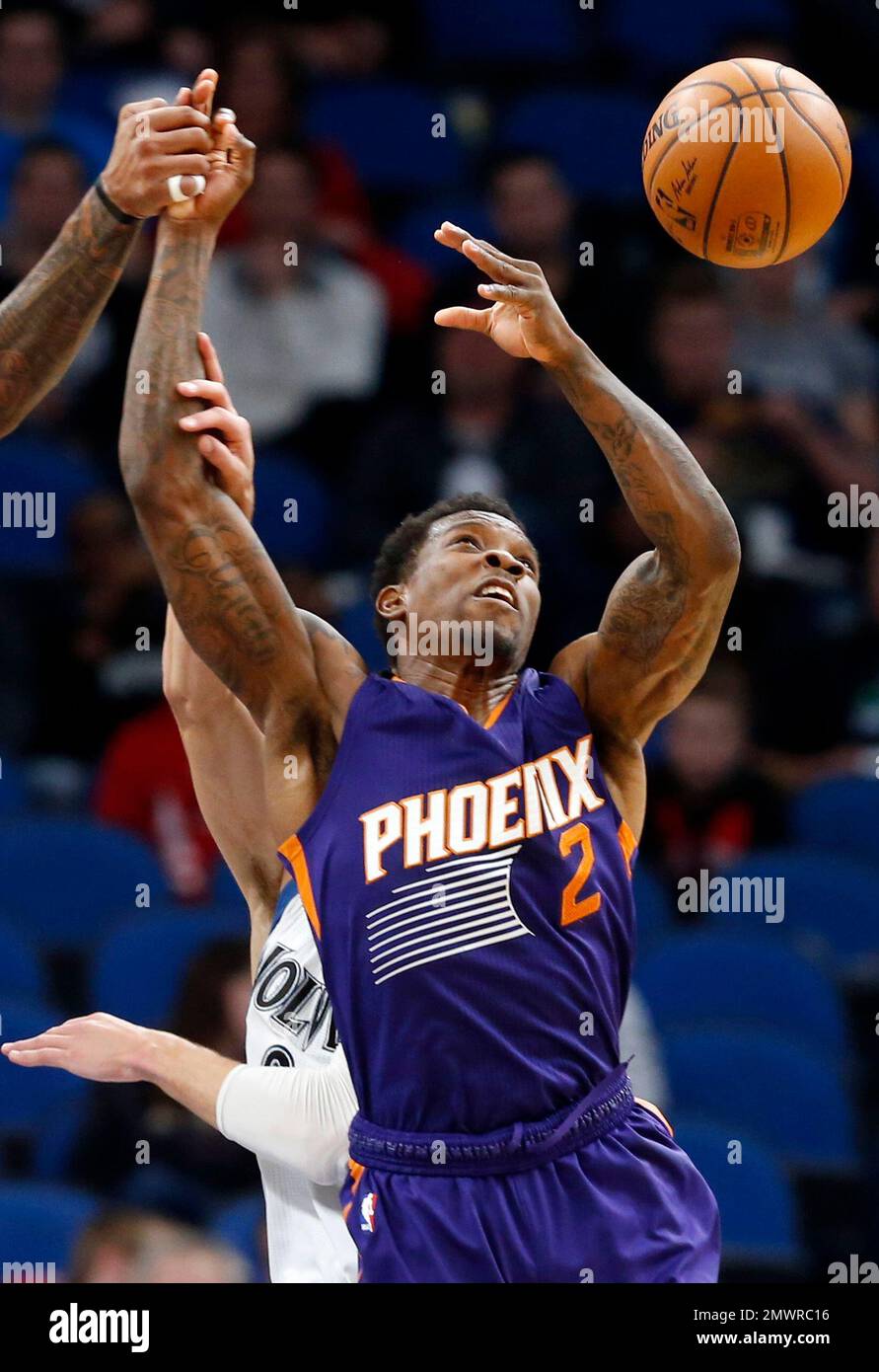 Phoenix Suns' Eric Bledsoe, right, loses the ball as he is fouled by ...