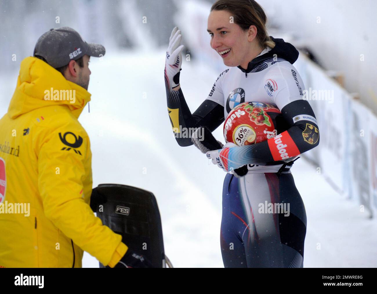 Jacqueline Loelling, of Germany, reacts with a teammate in the finish ...