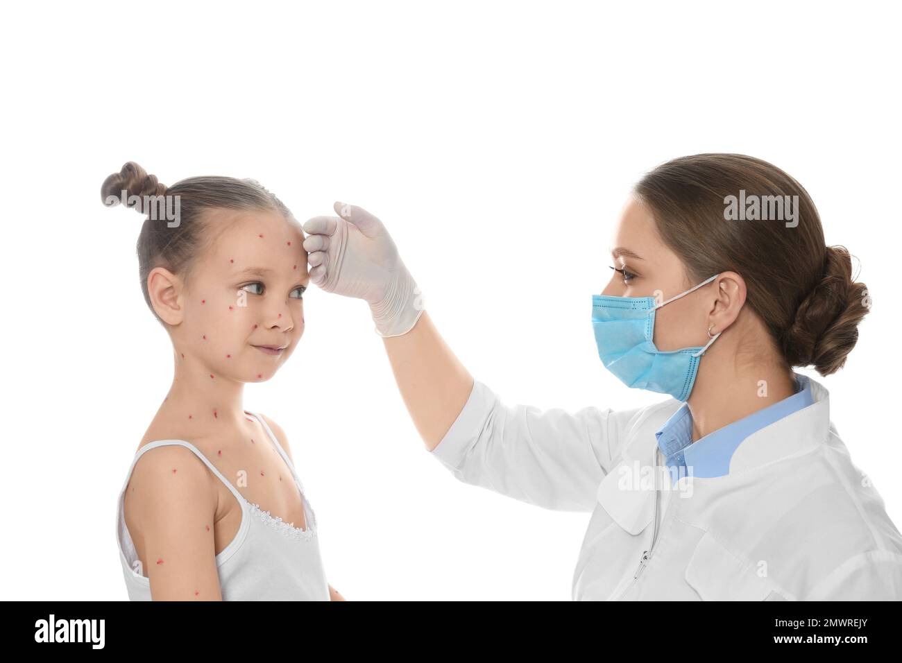 Doctor examining little girl with chickenpox on white background ...