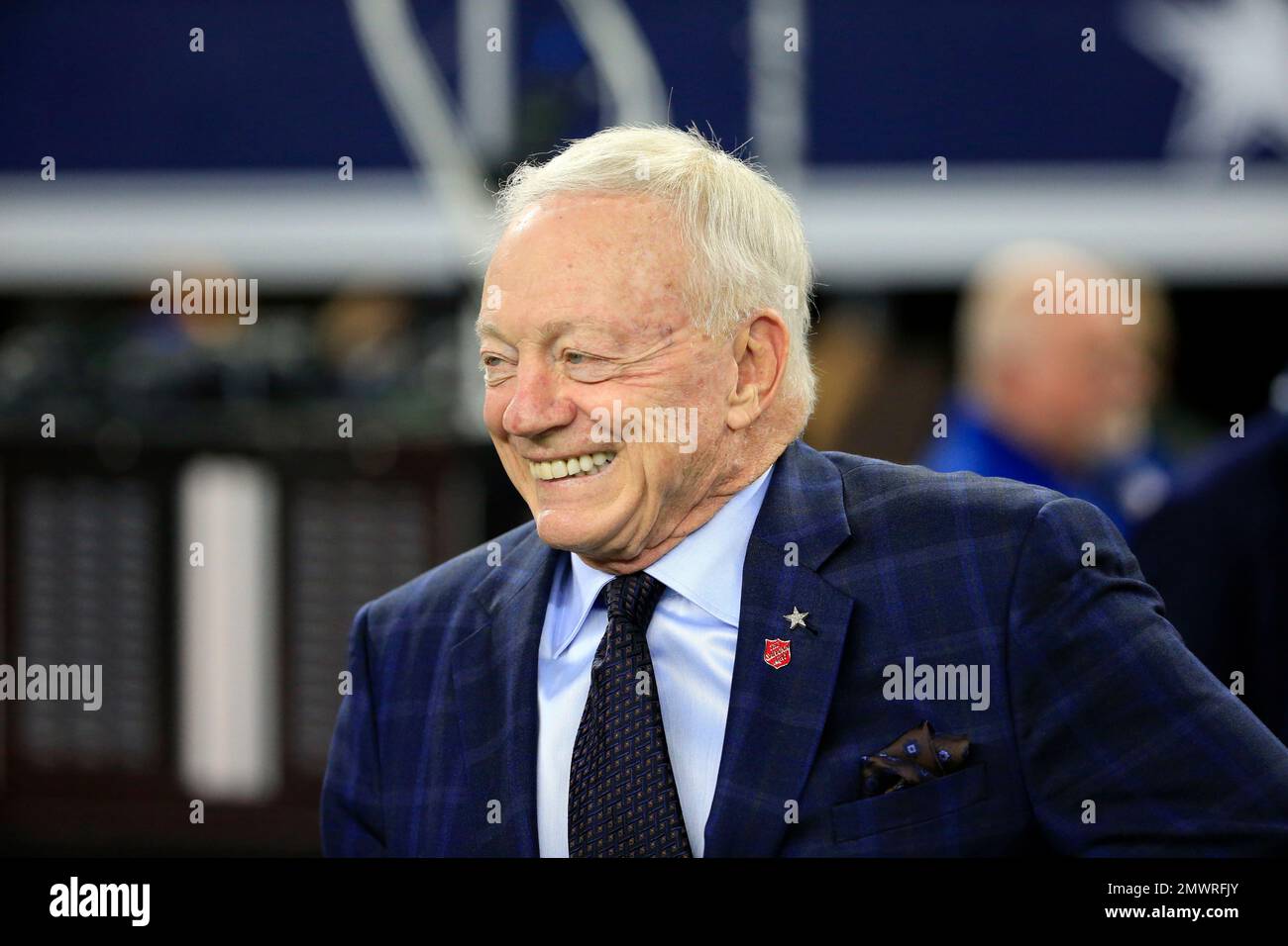 Dallas Cowboys team owner Jerry Jones smiles as he walks onto the field ...