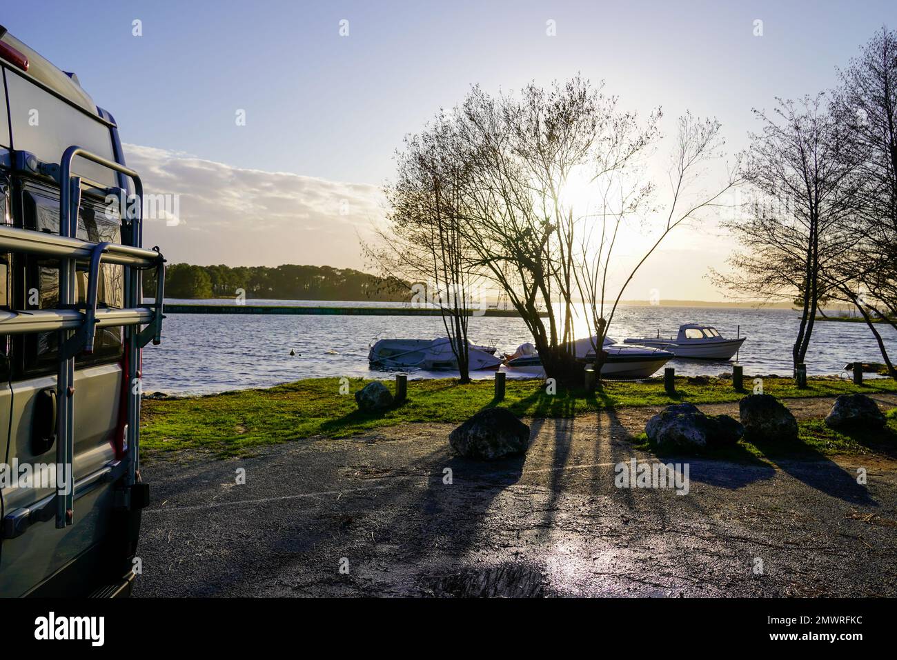 camper van rv by the lake in sunset vanlife morning sunrise Stock Photo ...
