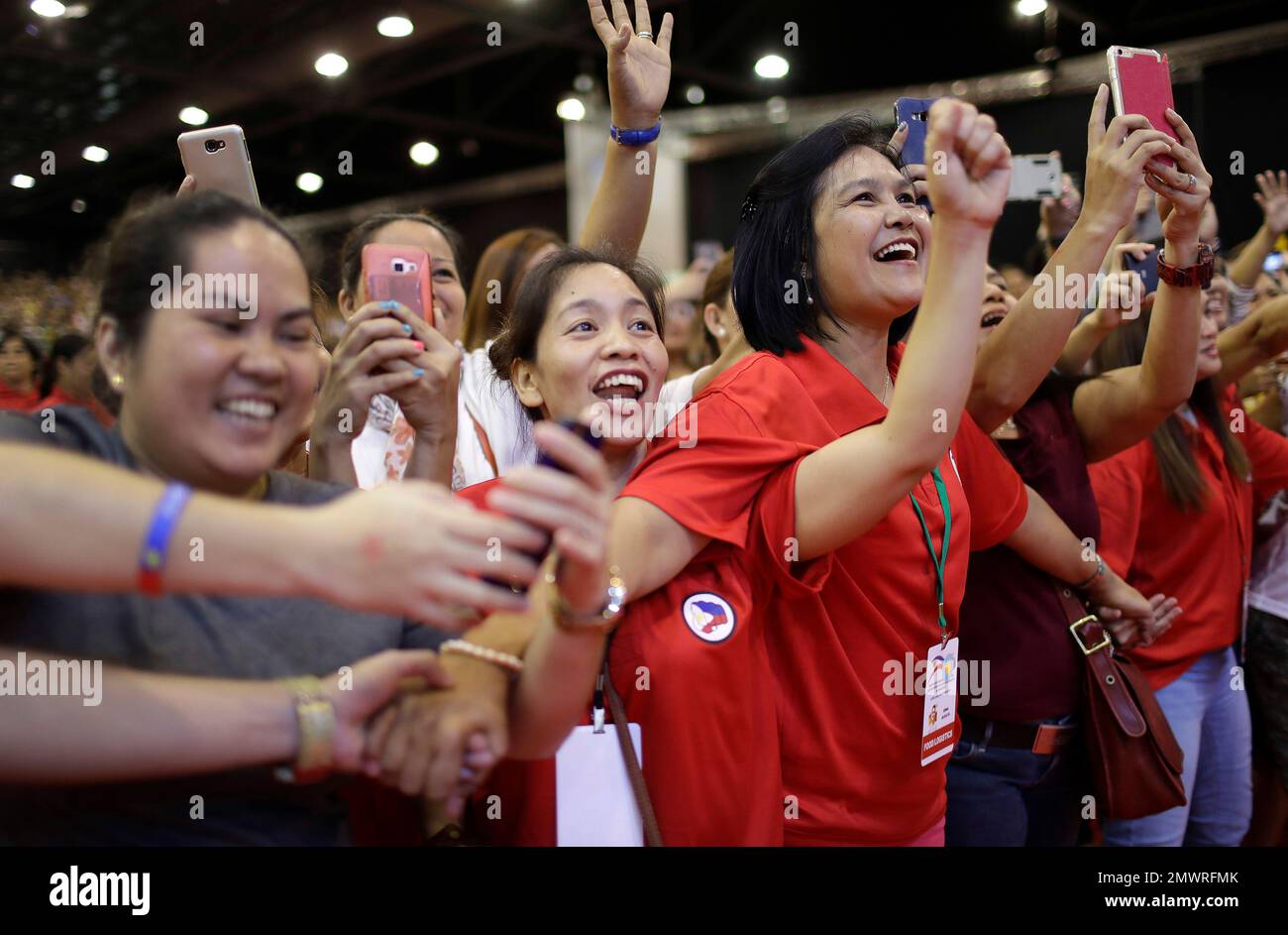 In this Friday, Dec. 16, photo, Filipino supporters cheer as Philippine ...