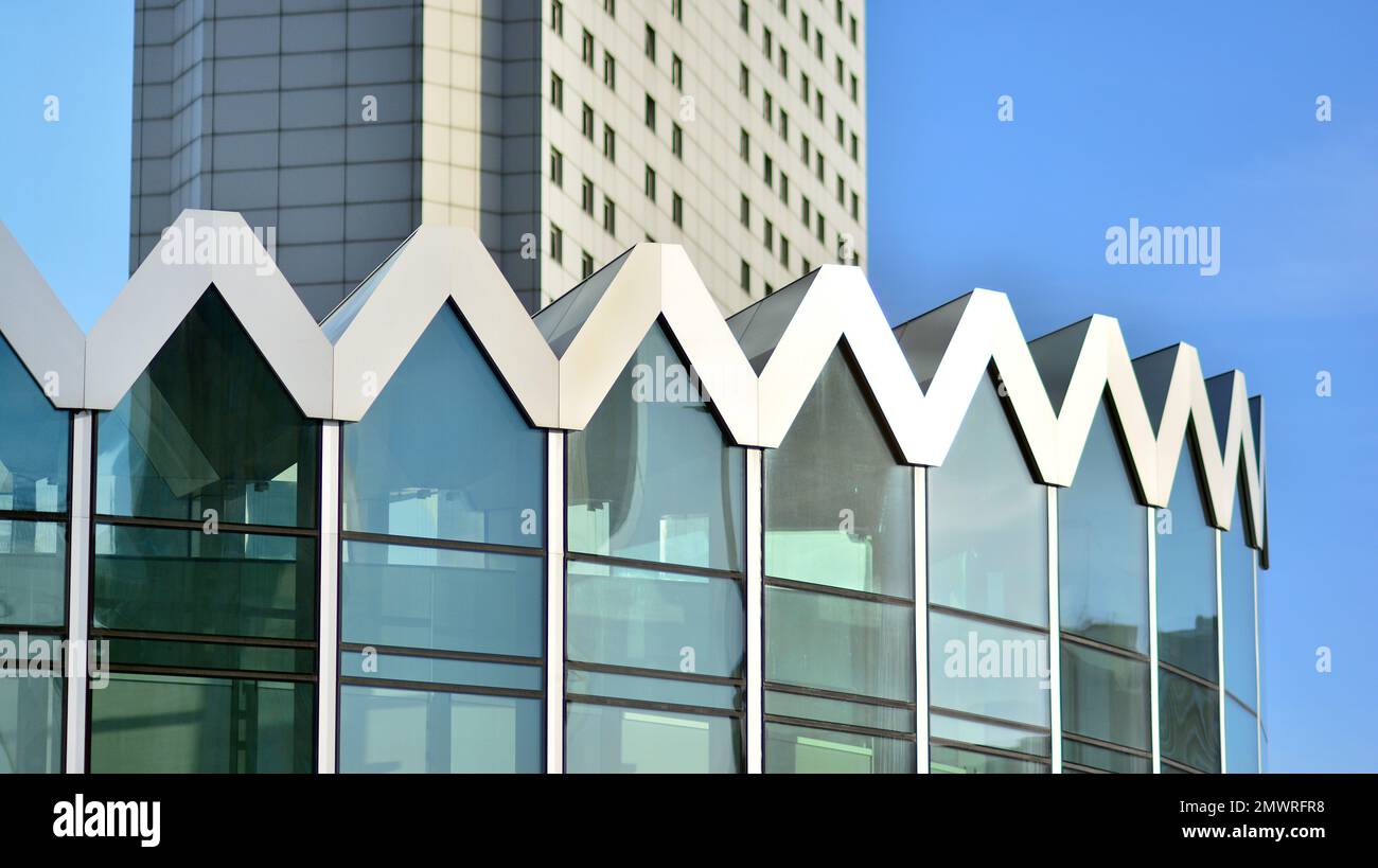 Glass building with transparent facade of the building and blue sky ...