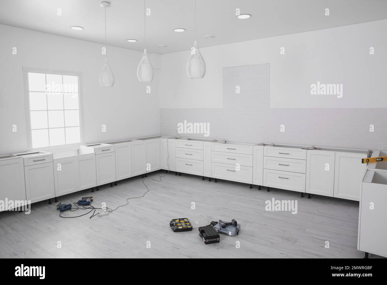 Stylish kitchen interior with newly installed furniture Stock Photo - Alamy