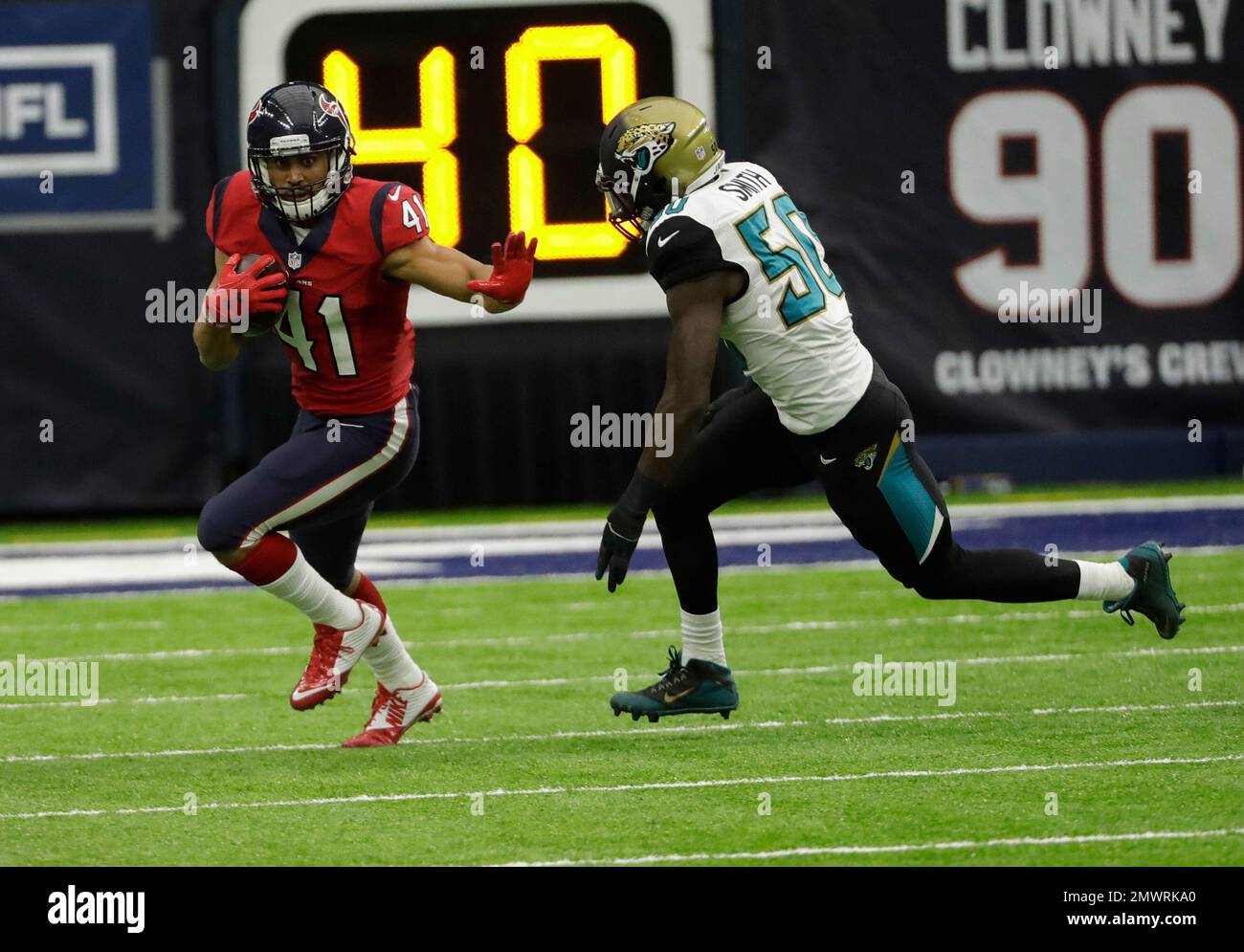 Houston Texans running back Jonathan Grimes (41) tries to fend off ...
