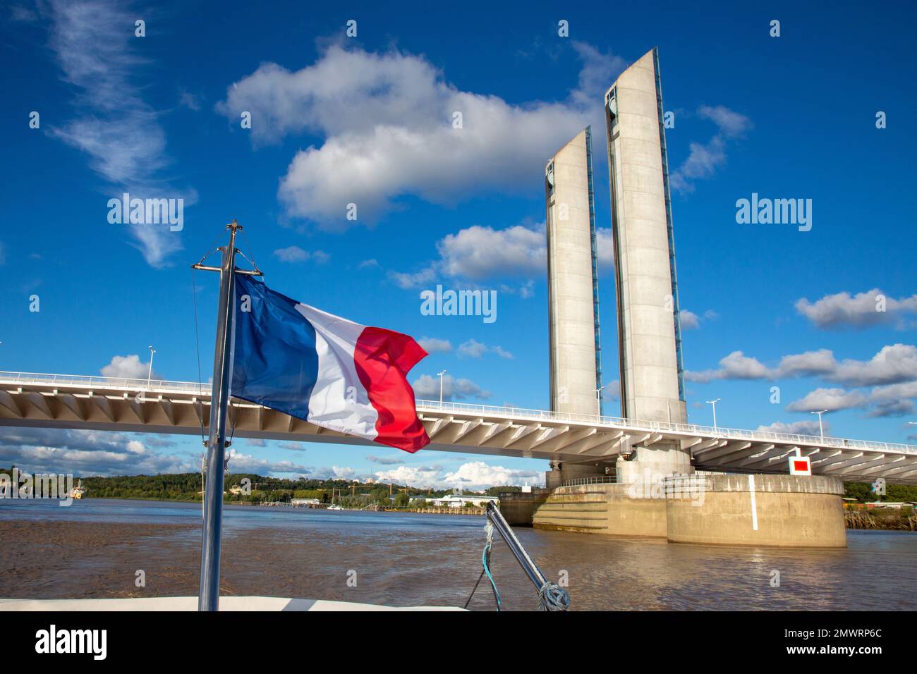 lift modern bridge in Bordeaux with french boat flag front ...
