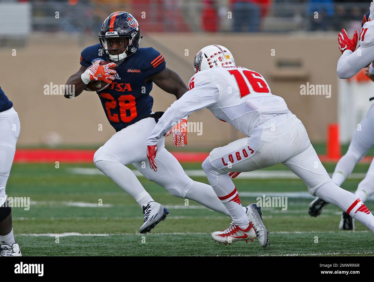 UTSA running back Jalen Rhodes carries as New Mexico safety Jacob ...