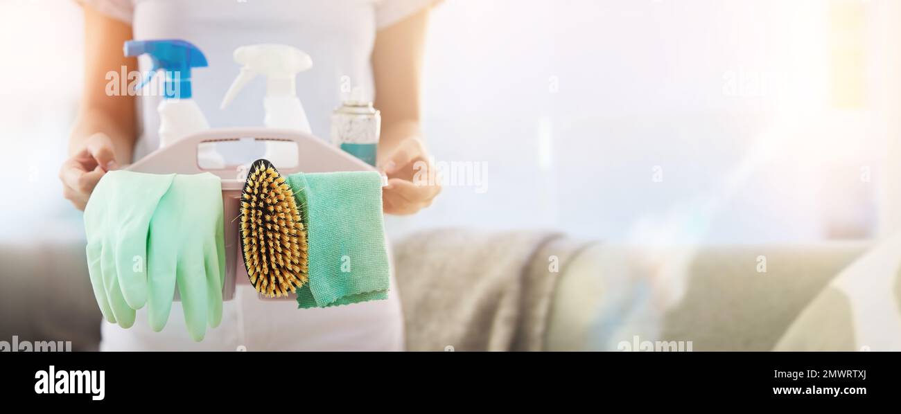 Hands, cleaning and mockup with a woman housekeeper holding a basket of ...