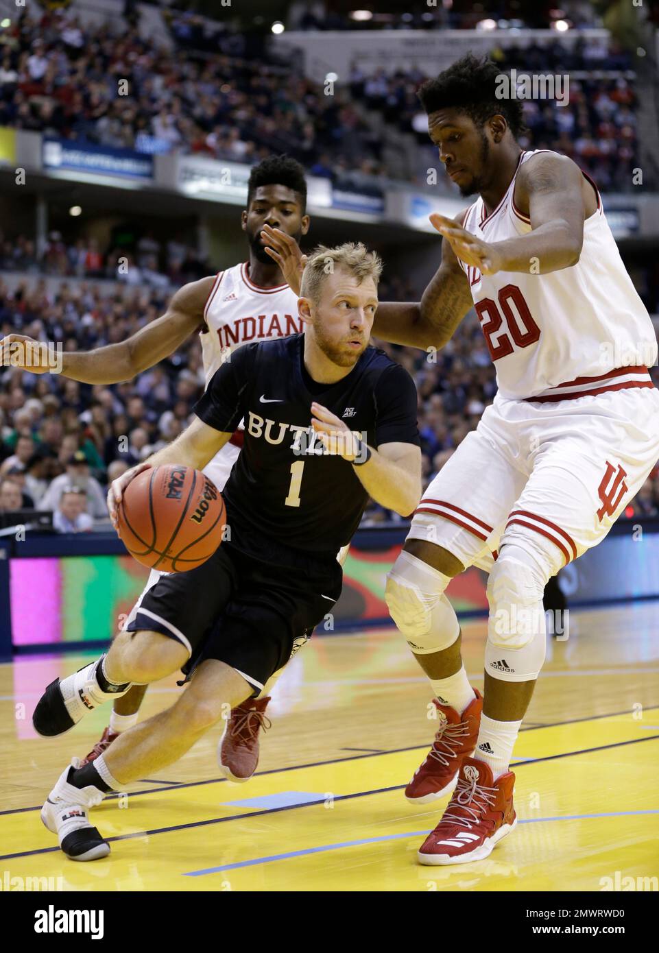 Butler guard Tyler Lewis (1) drives past Indiana forward De'Ron Davis ...