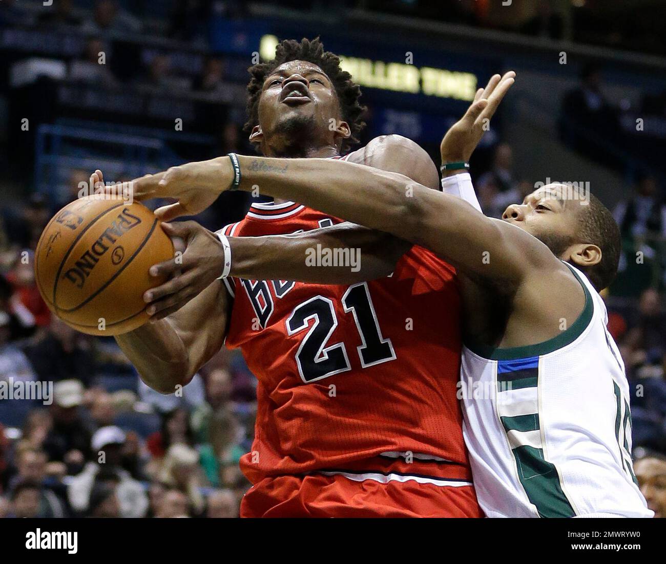 Chicago Bulls' Jimmy Butler (21) goes up for a shot against Milwaukee ...