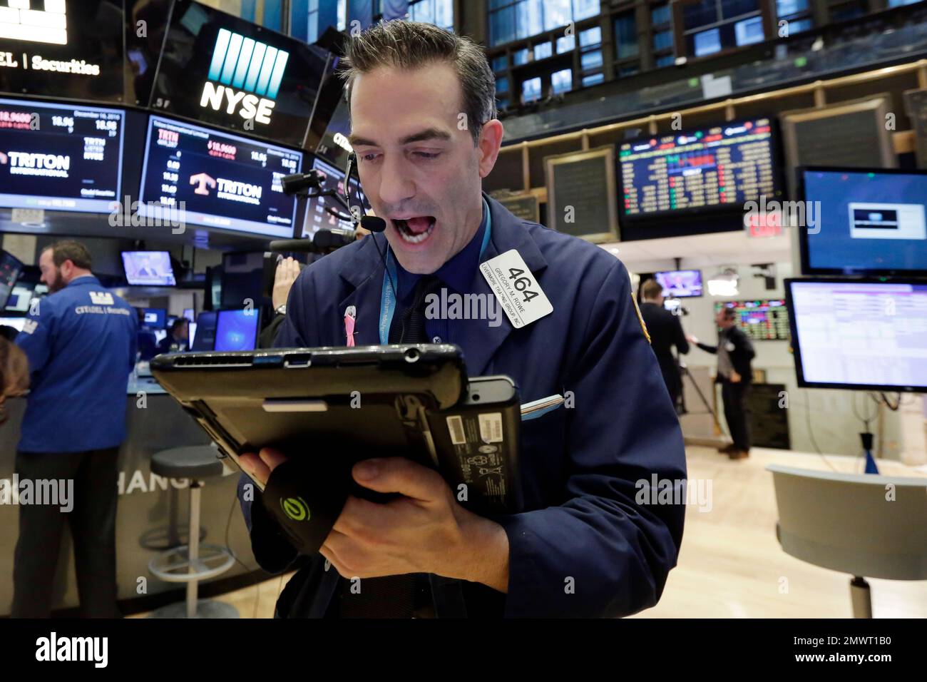 Trader Gregory Rowe works on the floor of the New York Stock Exchange ...
