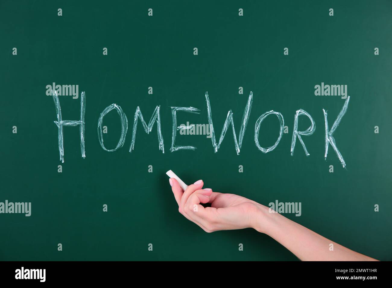 Woman writing word homework hi-res stock photography and images - Alamy